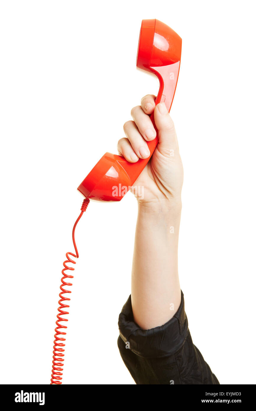 Female hand holding a red phone receiver Stock Photo - Alamy