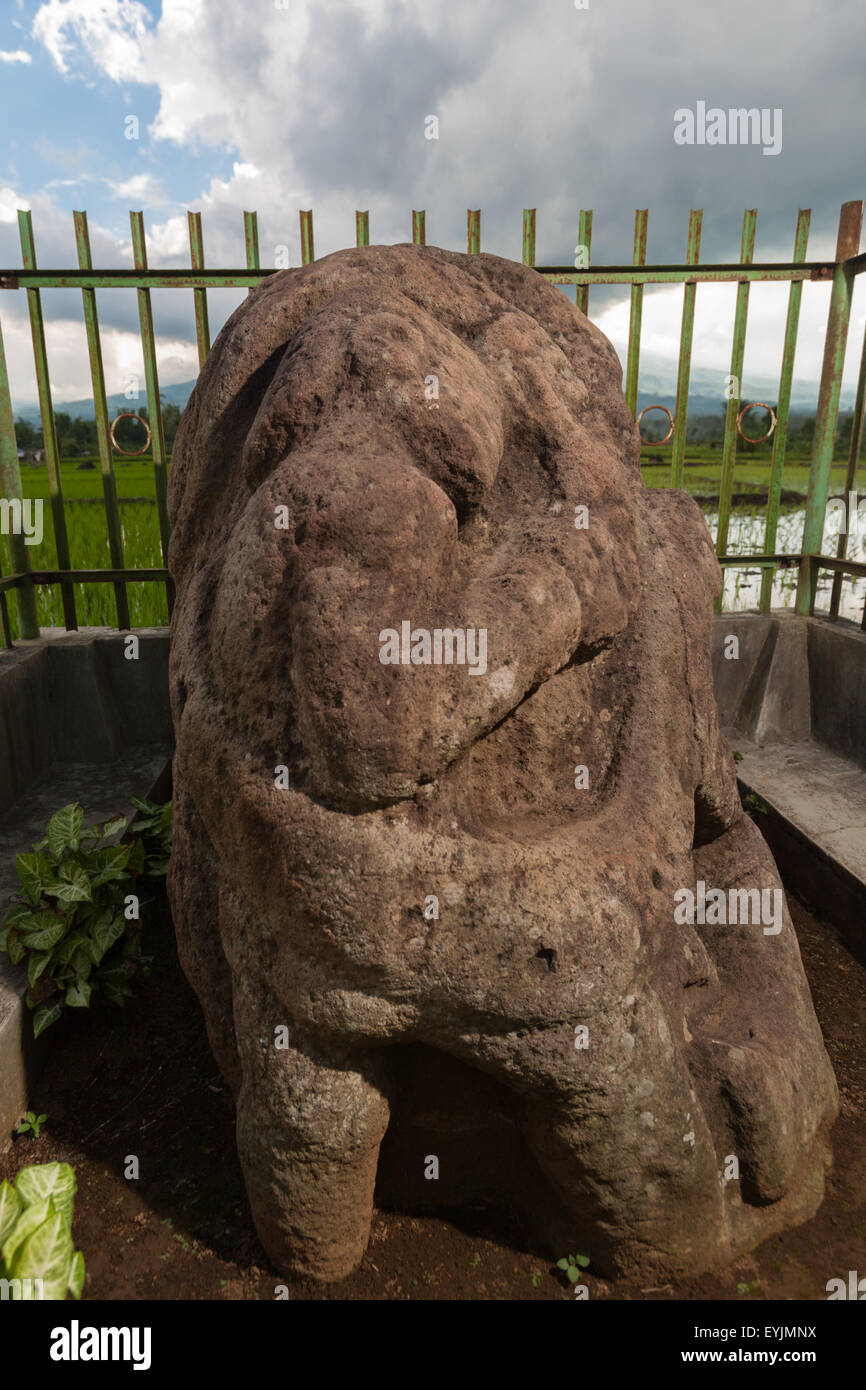 Megalithic sculpture in form of human figure wrapped around a snake in ...