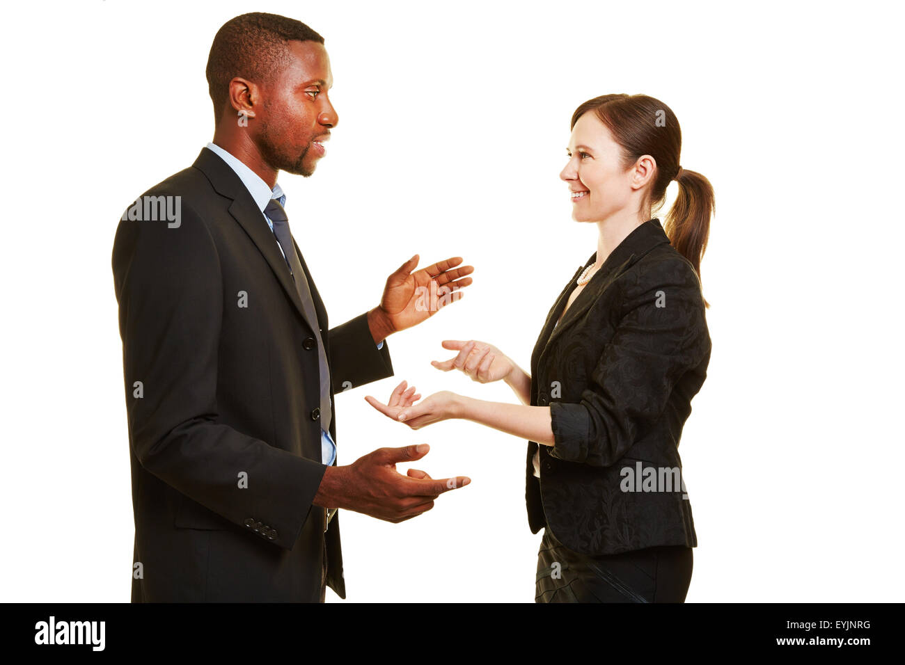 Two business people talking to each other and negotiating Stock Photo ... Two business people talking to each other and negotiating Stock Photo ...