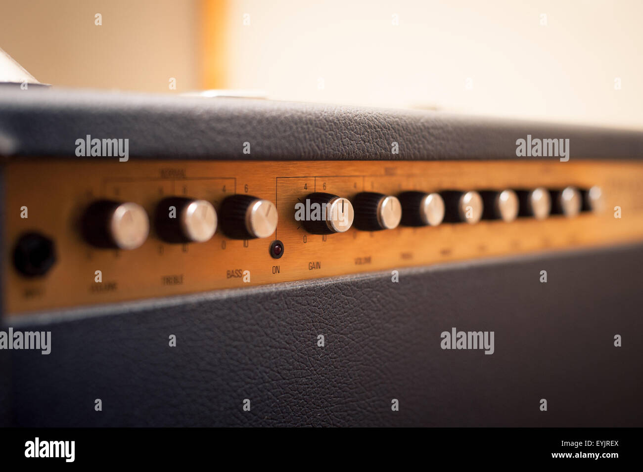 Guitar amplifier knobs detail in studio with selective focus on knobs ...