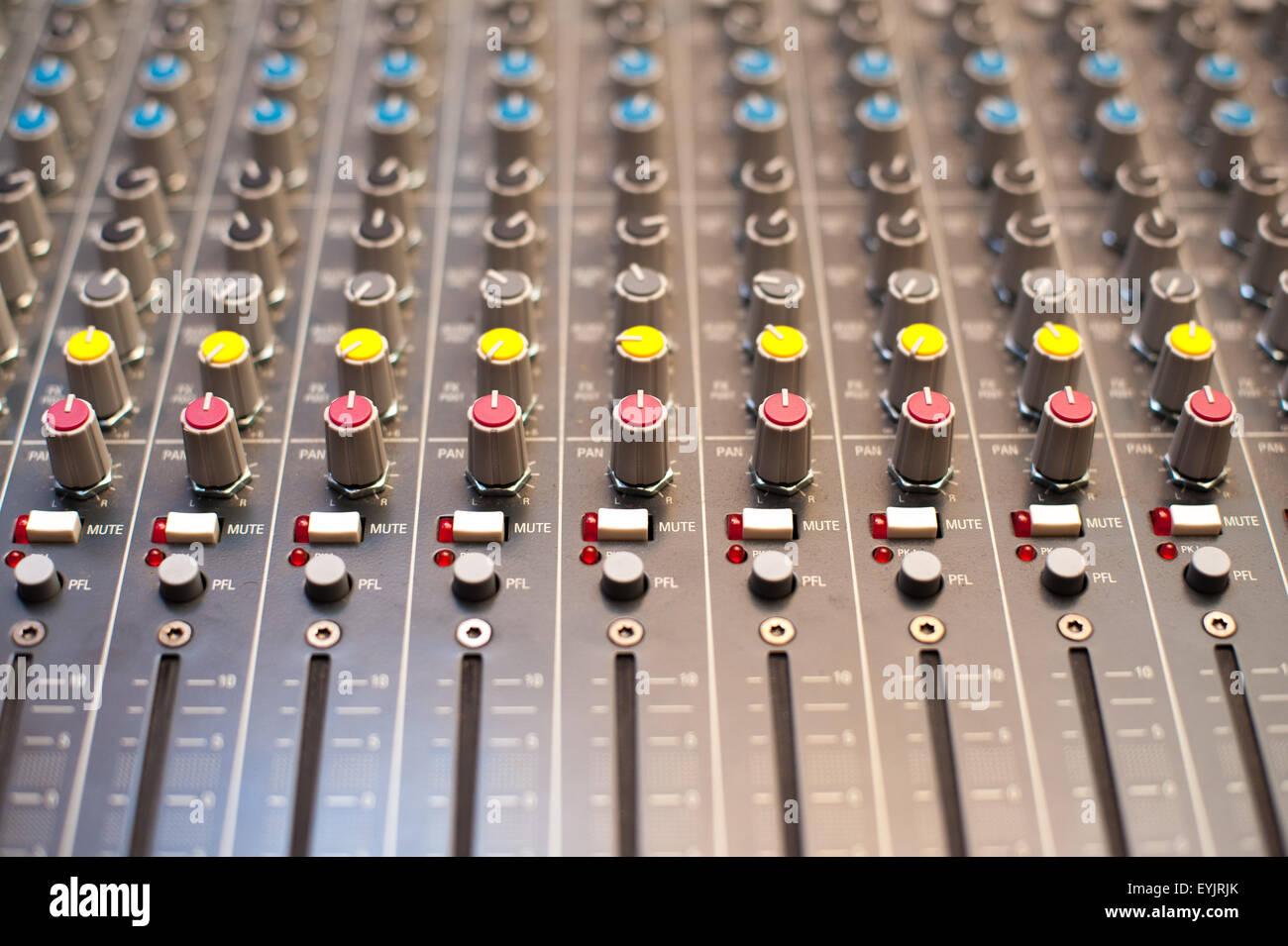 Music studio mixer detail of knobs and buttons in selective focus Stock ...