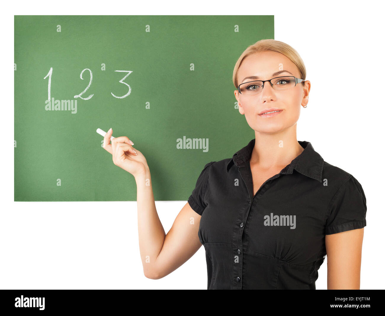 Portrait of young beautiful smart teacher standing near chalkboard and ...