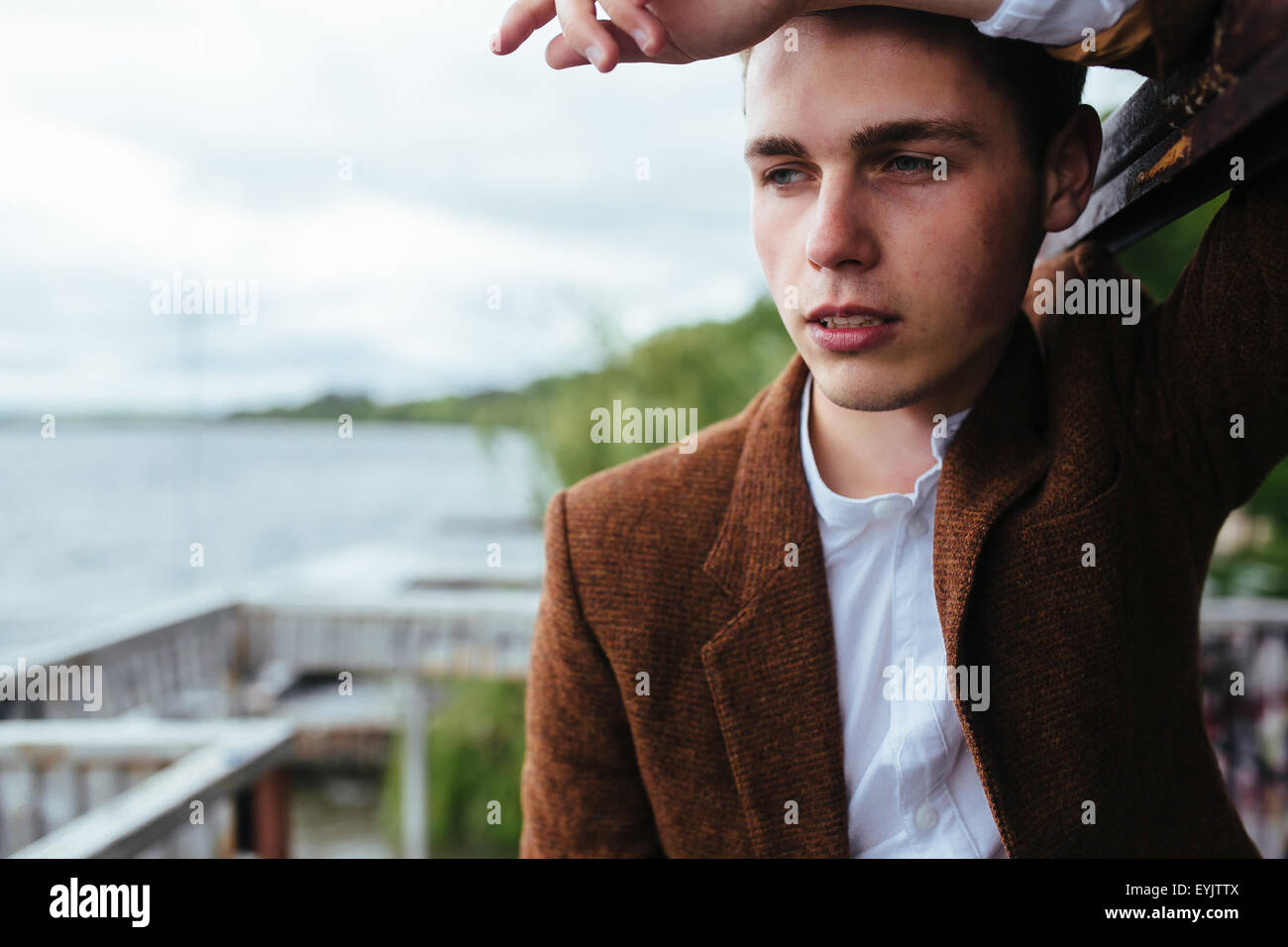 man standing on a pier Stock Photo - Alamy