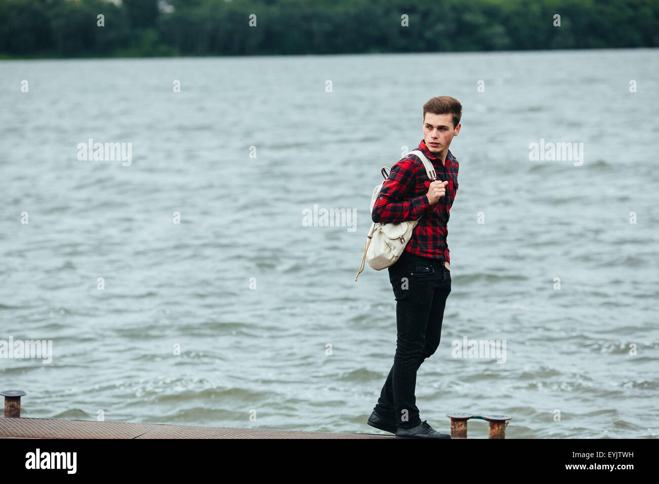 man standing on a pier Stock Photo - Alamy