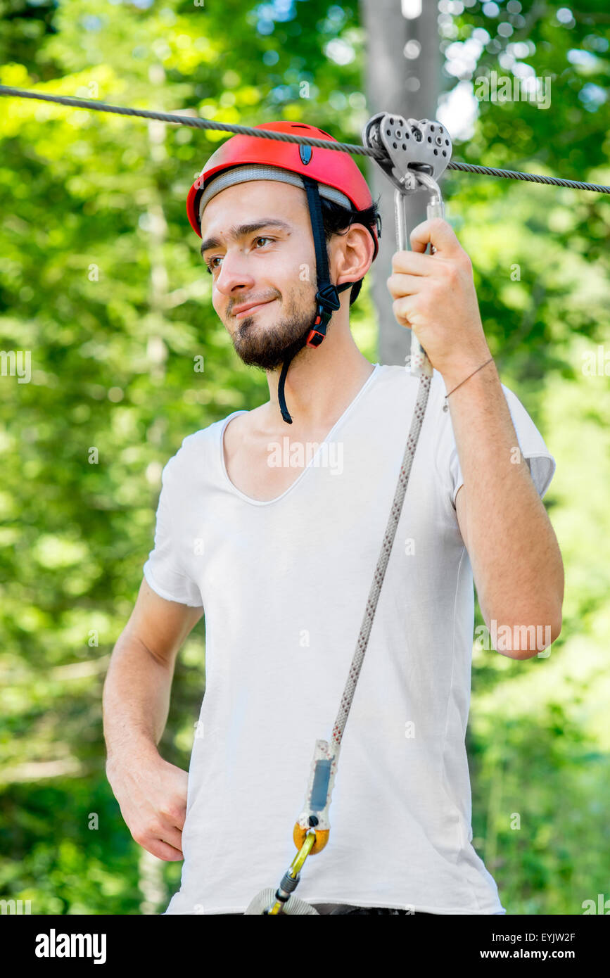 Man riding on a zip line Stock Photo - Alamy