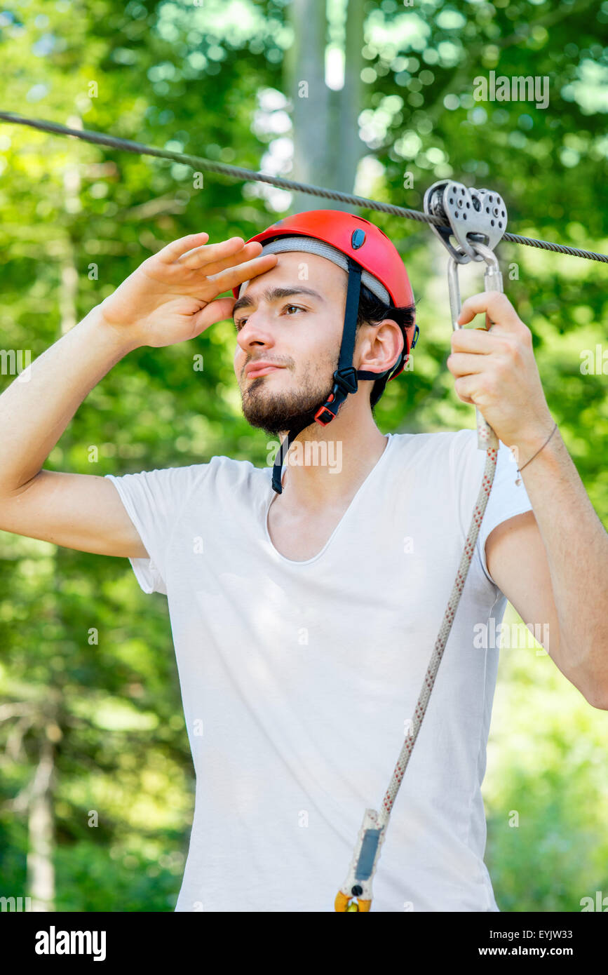 Man riding on a zip line Stock Photo - Alamy