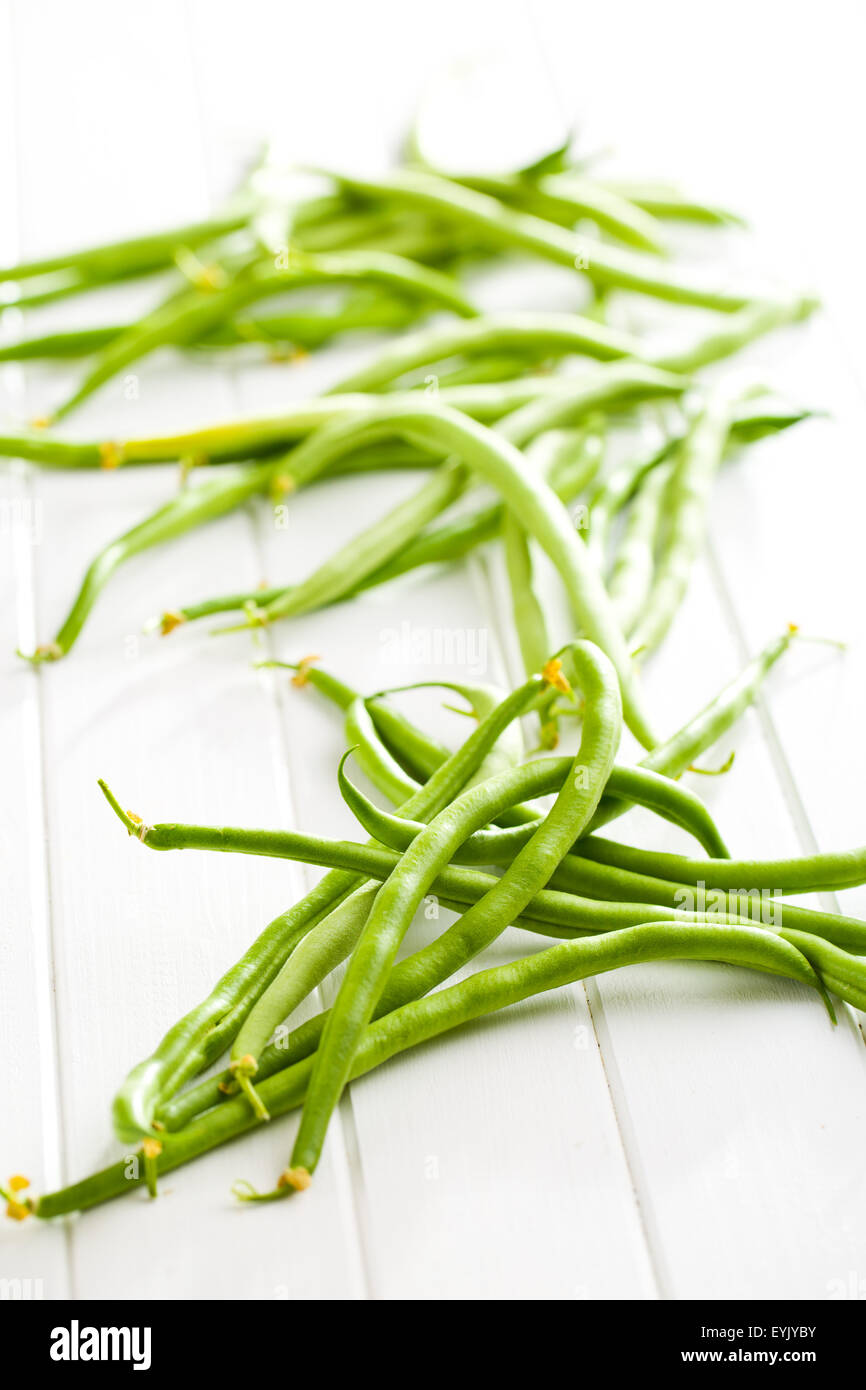 the green beans on white kitchen table Stock Photo - Alamy
