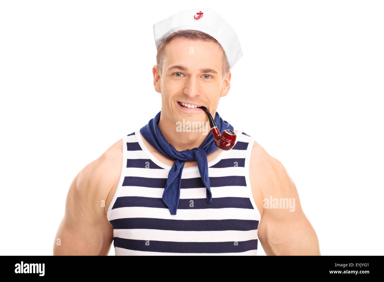 Cheerful young sailor smoking a pipe and looking at the camera isolated ...