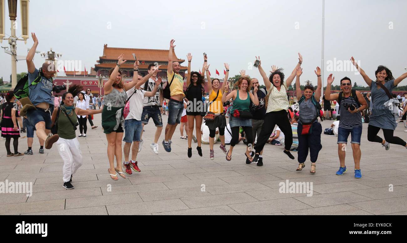 Beijing, China. 31st July, 2015. Foreign tourists pose for photo on the ...