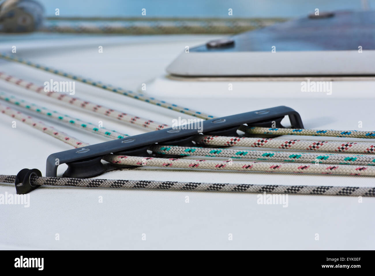 Details of sailing boat. Color ropes on white deck Stock Photo - Alamy