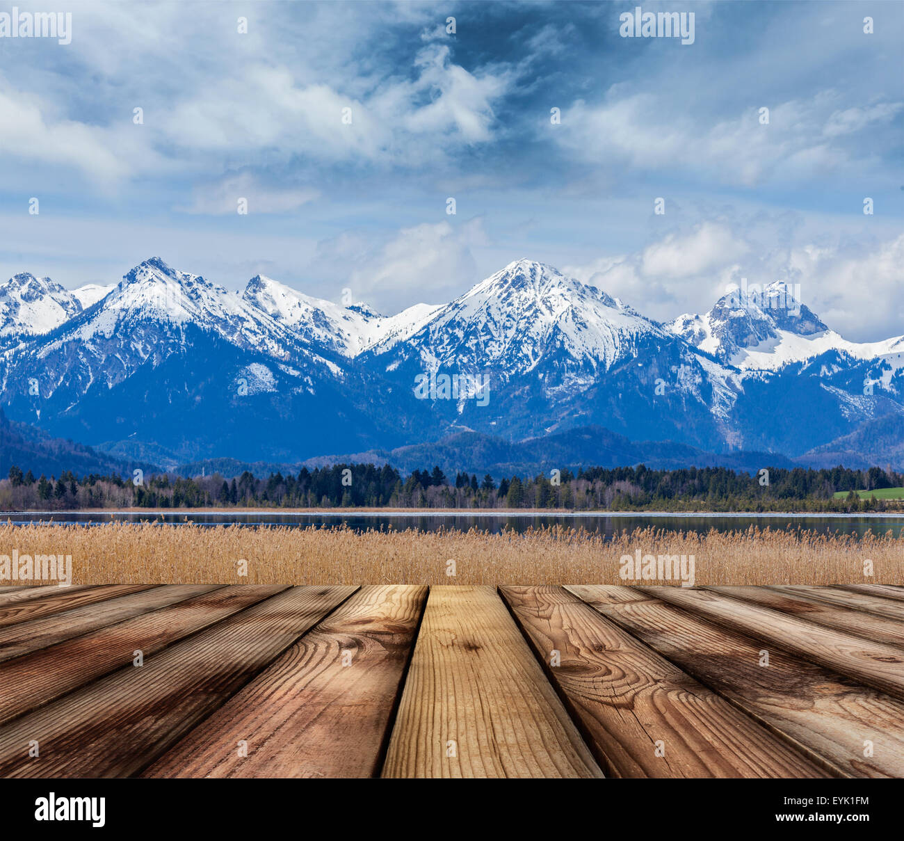 Wooden planks floor with Bavarian Alps countryside lake landscape in ...