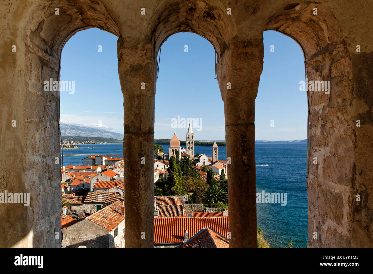 View of Rab Town through arch of Roman bell tower in Rab, Croatia ...