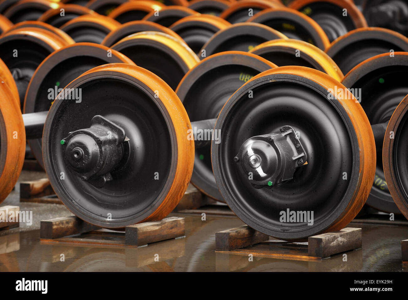 New train wheels on the factory production line Stock Photo - Alamy