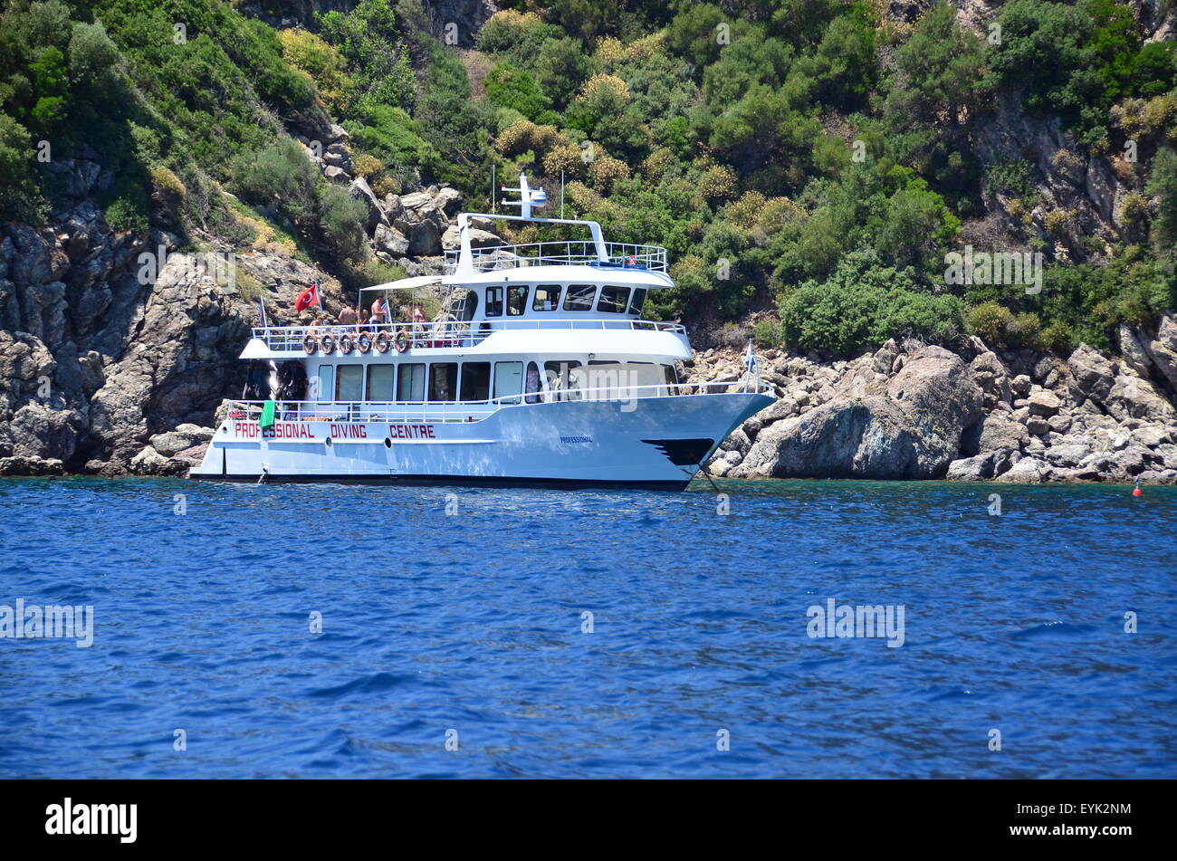 Tourists take diving trips on boats in the sea off the coast of ...