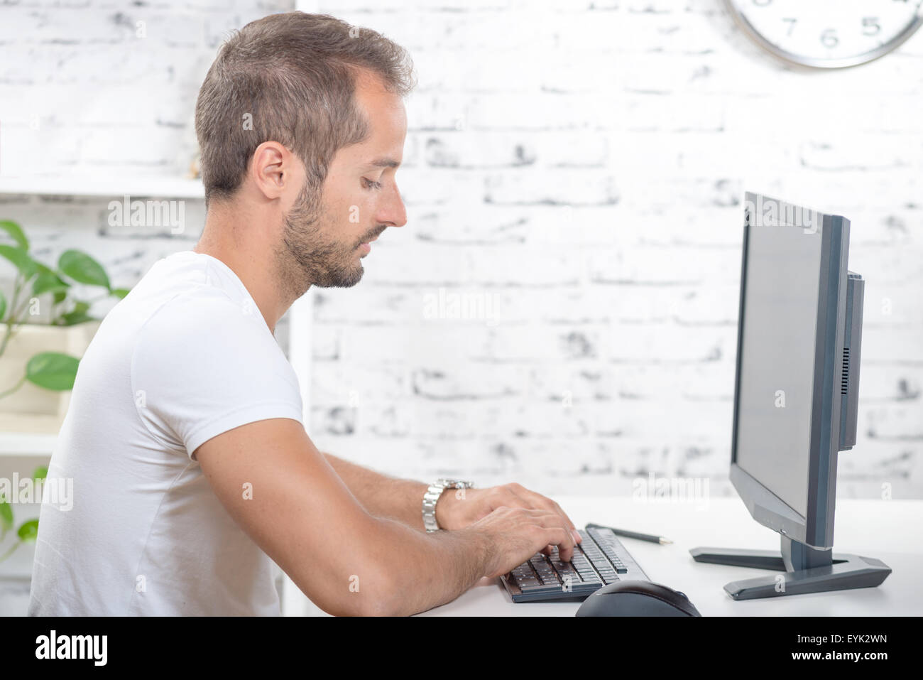 young executive working with his computer in his office Stock Photo - Alamy