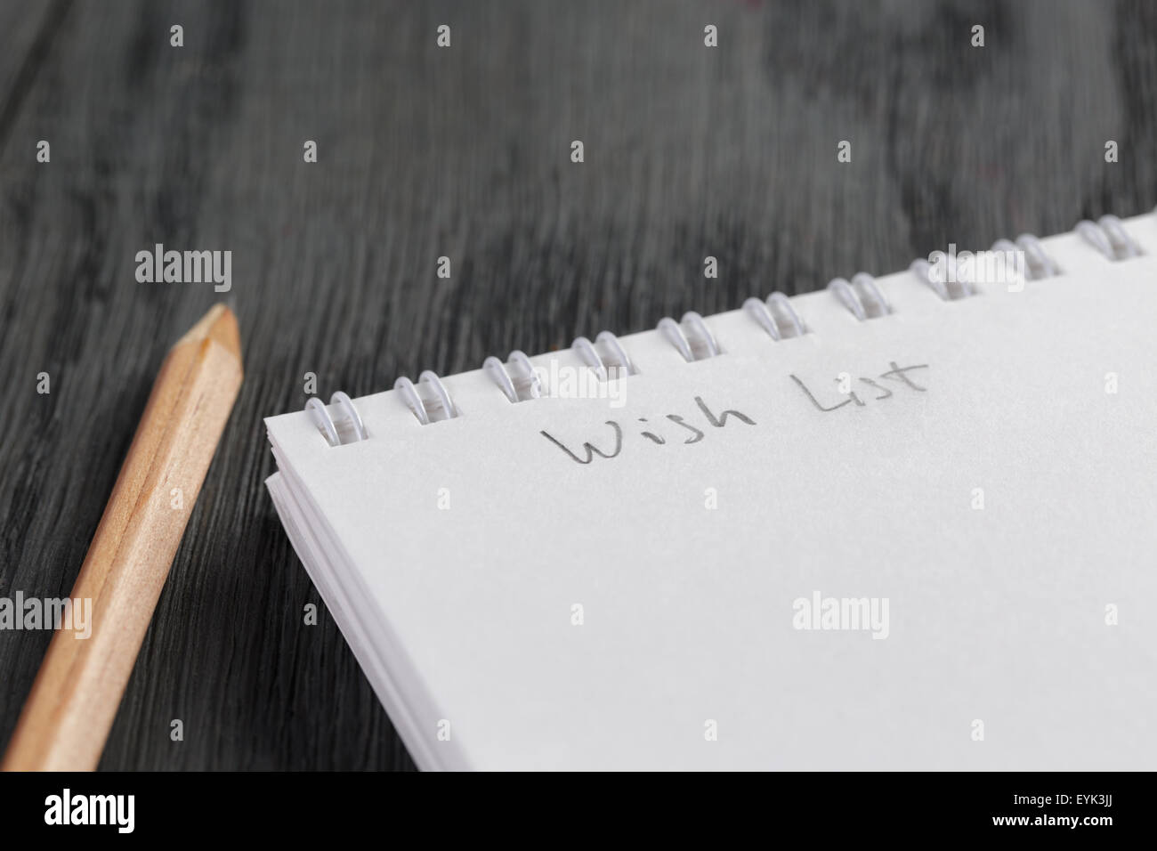 closeup photo of open empty notepad with wish list phrase Stock Photo ...