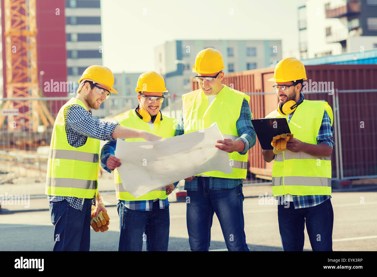 group of builders with tablet pc and blueprint Stock Photo - Alamy