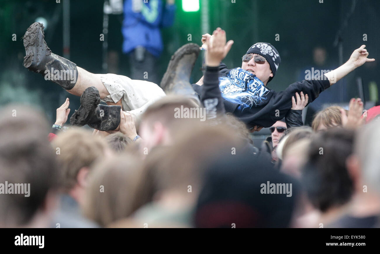 Wacken, Germany. 31st July, 2015. A festival-goer crowd surfs during a ...