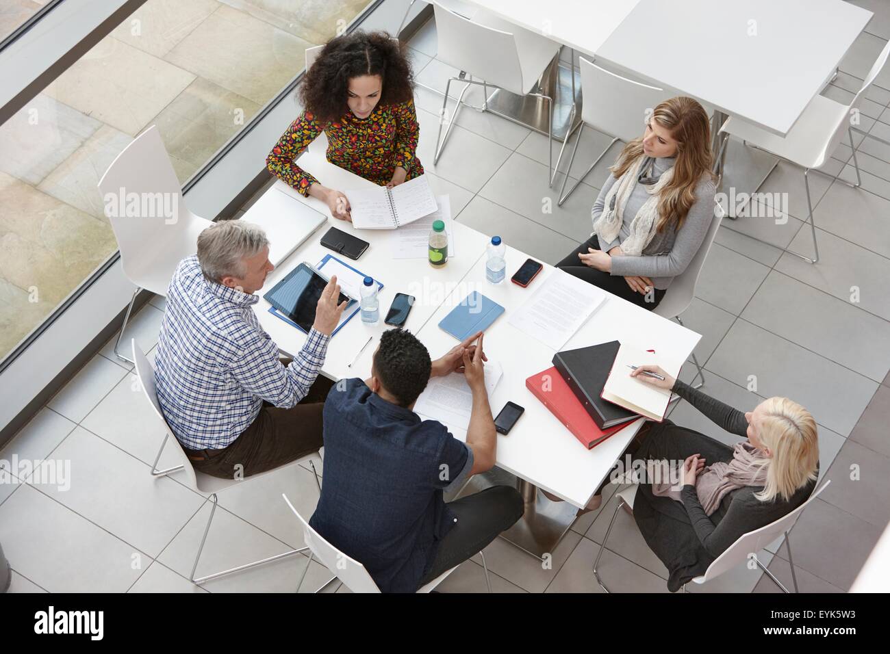 Overhead view of business team meeting at conference table Stock Photo ...
