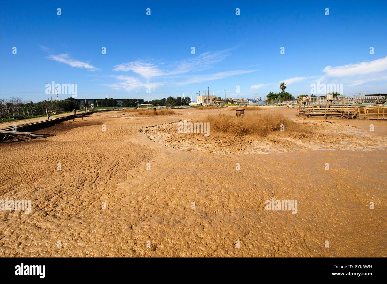 View of brown sludge treatment pool at sewage treatment plant Stock ...