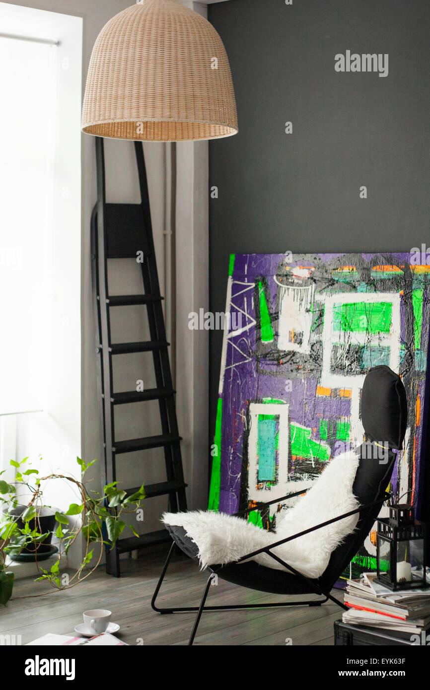 Sitting room with vintage styled armchair and abstract painting Stock ...