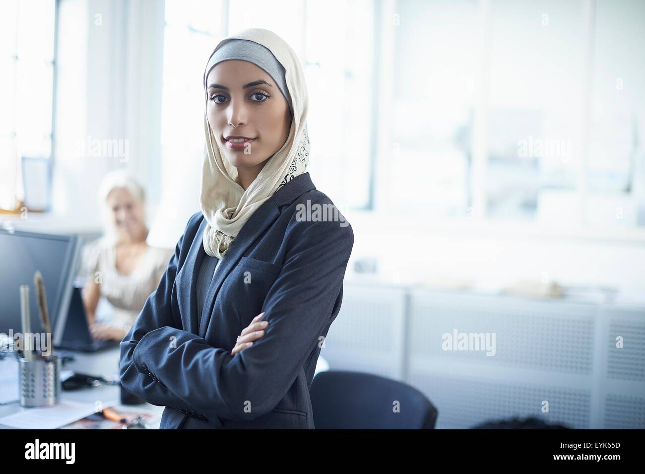 Portrait of young businesswoman wearing hijab in office Stock Photo - Alamy