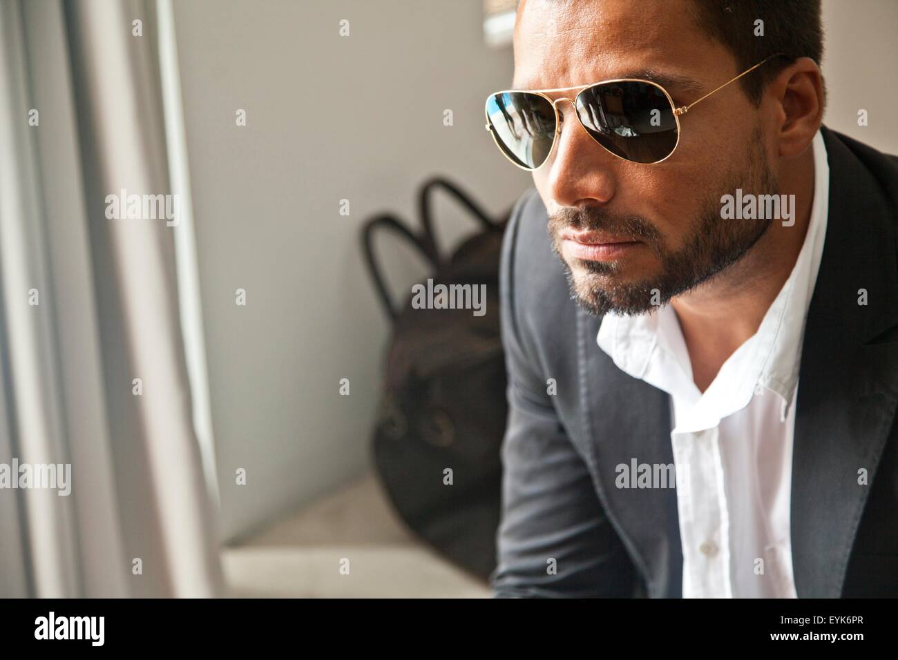 Man waiting indoors Stock Photo - Alamy