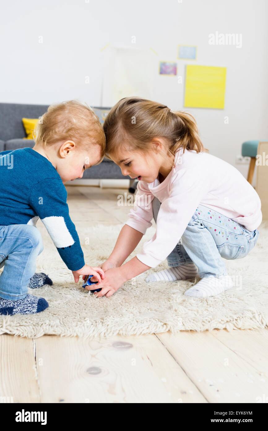 Brother and sister playing at home Stock Photo - Alamy