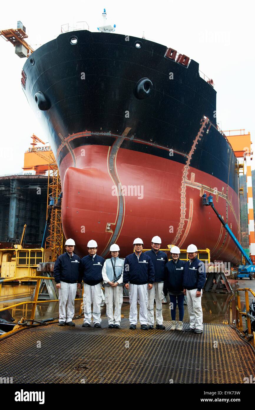Portrait of workers at shipyard, GoSeong-gun, South Korea Stock Photo ...