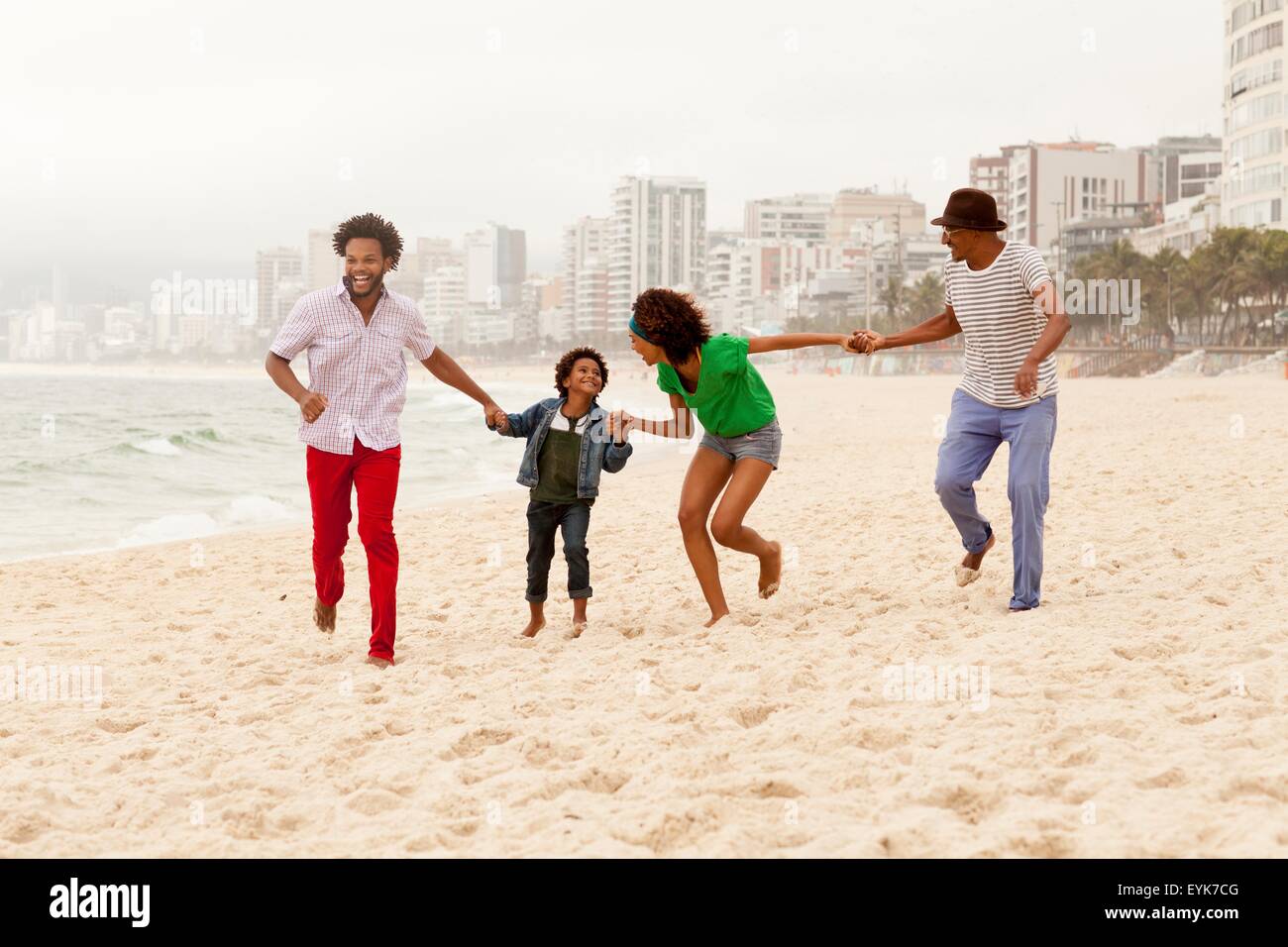 Three generation family enjoying beach, Rio de Janeiro, Brazil Stock ...