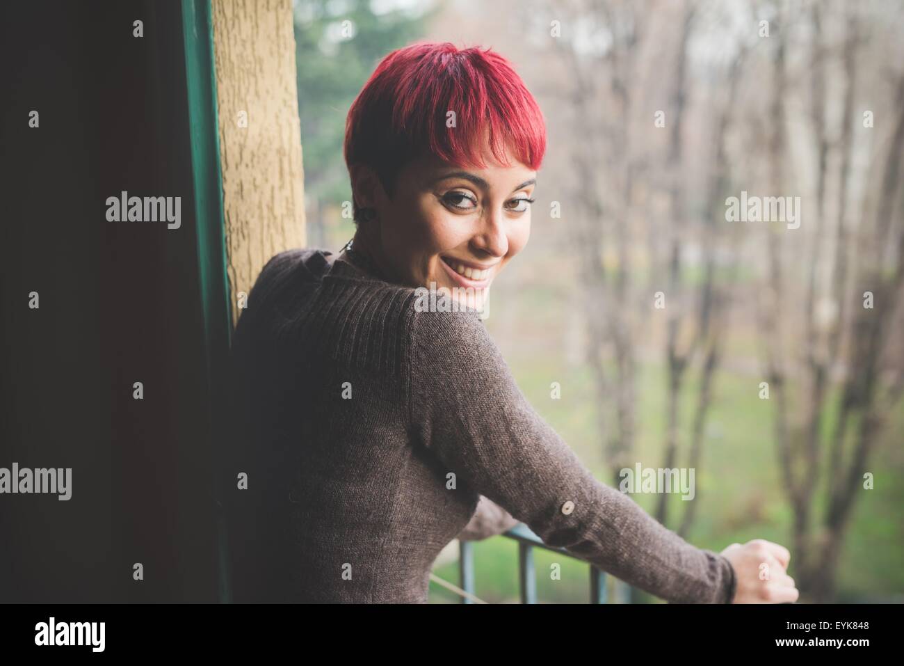 Leaning over balcony hi-res stock photography and images - Alamy