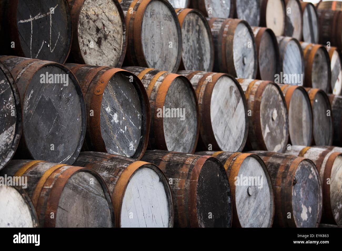 Stack of wooden whisky casks Stock Photo - Alamy