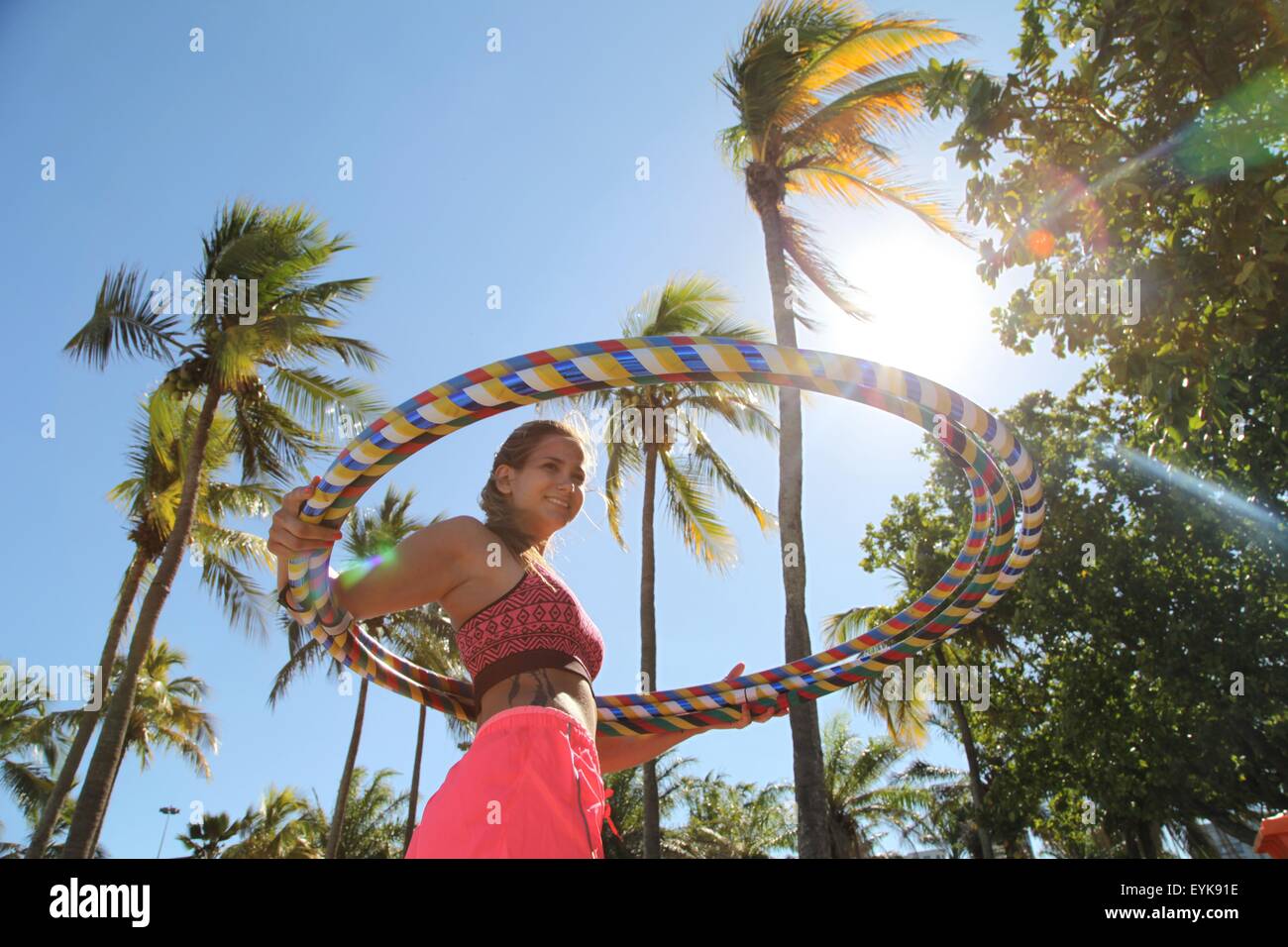 Young woman with plastic hoops Stock Photo - Alamy