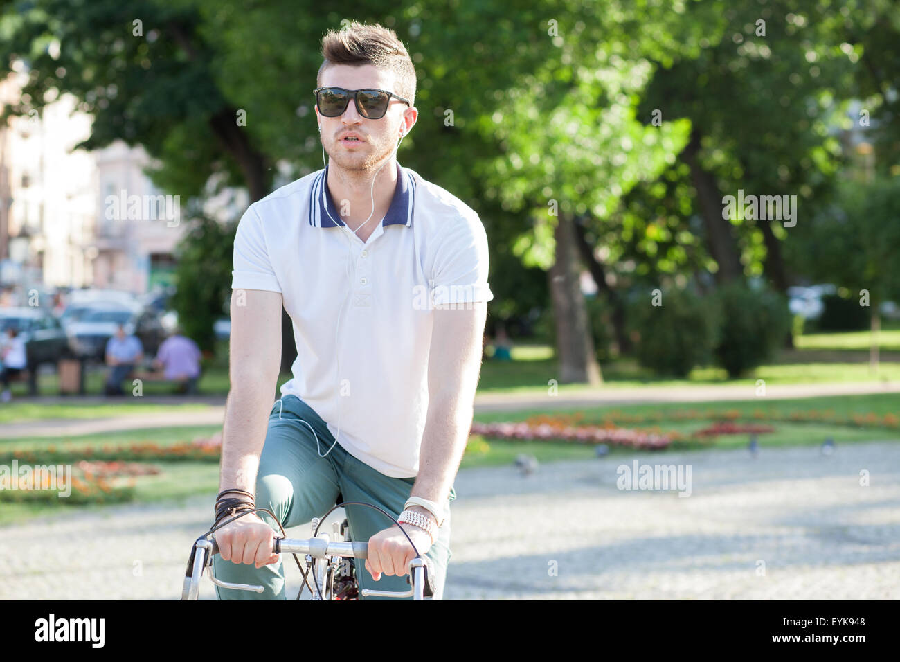 Stylish guy holding vintage race bike Stock Photo - Alamy