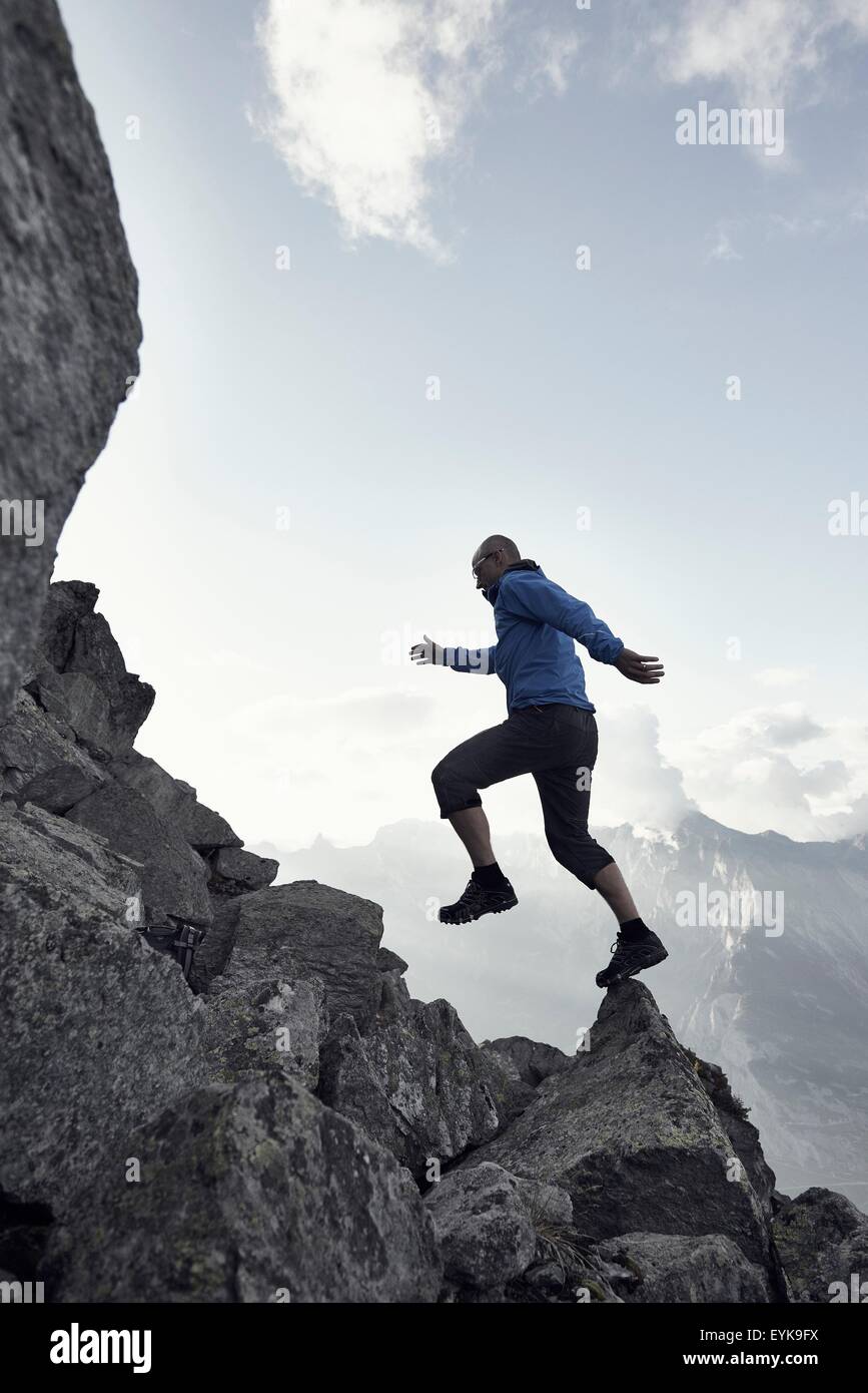 Man jumping on rocks hi-res stock photography and images - Alamy