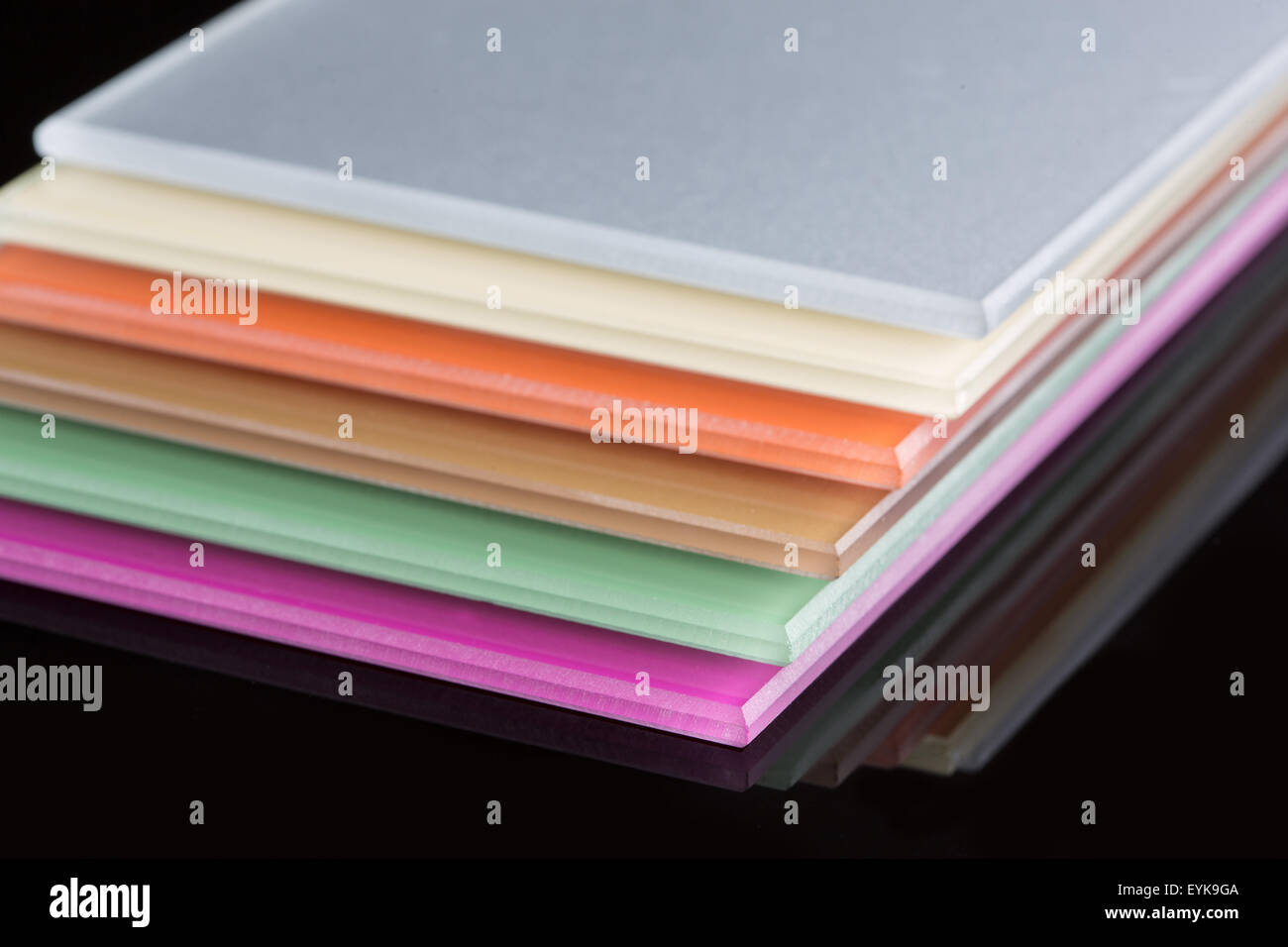 a stack of colored glass on a black background. glass sheets Stock ...