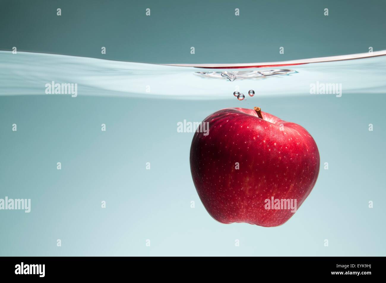 Red apple underwater Stock Photo - Alamy