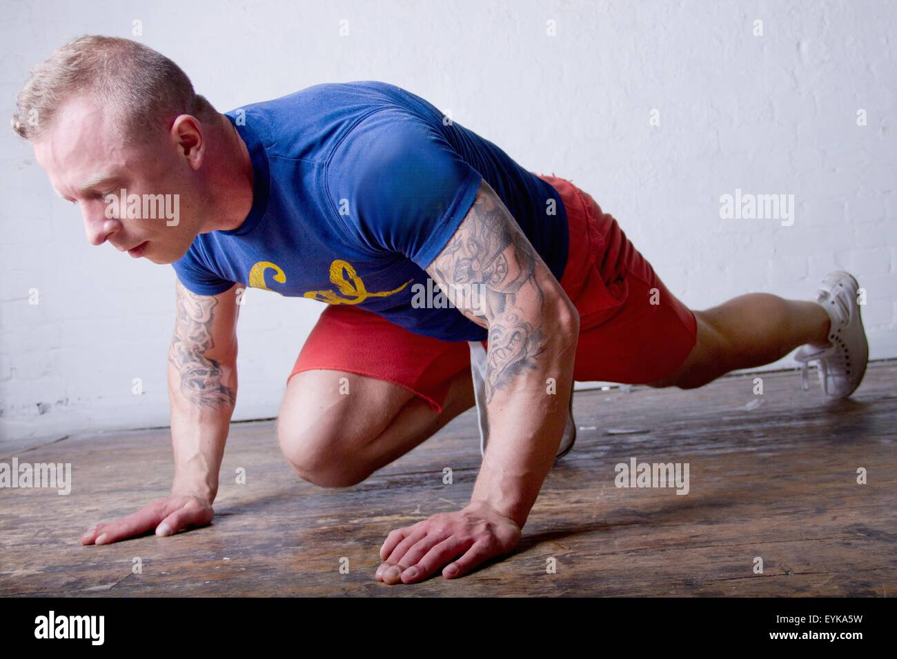 Young man exercising Stock Photo - Alamy