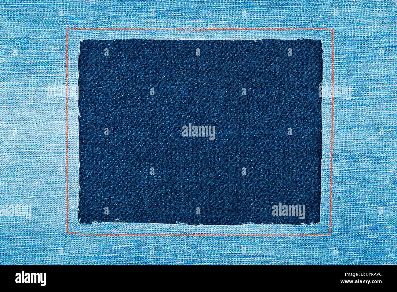 Frame made of light denim lies on a dark jeans Stock Photo - Alamy