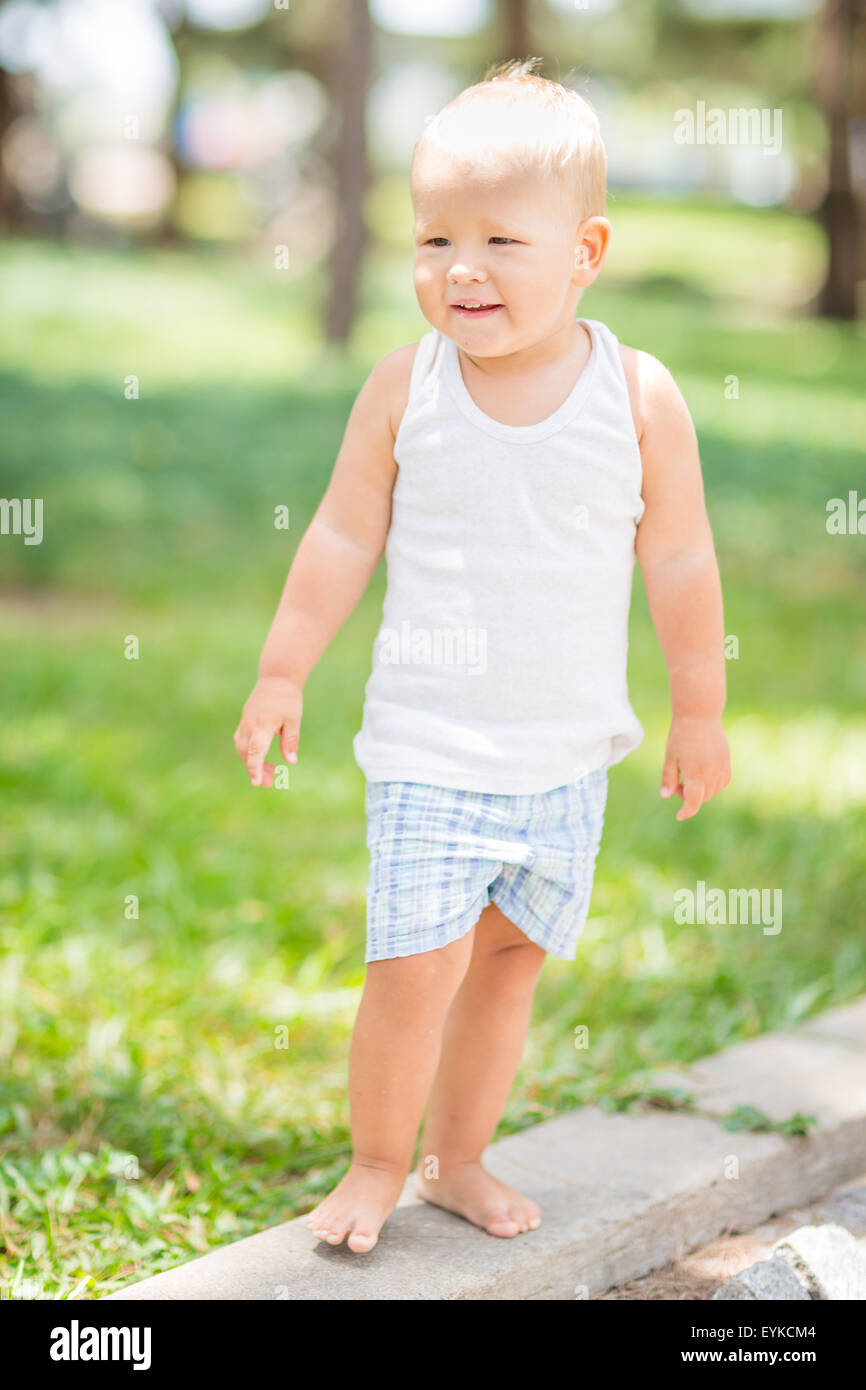 Baby walking in the park Stock Photo - Alamy