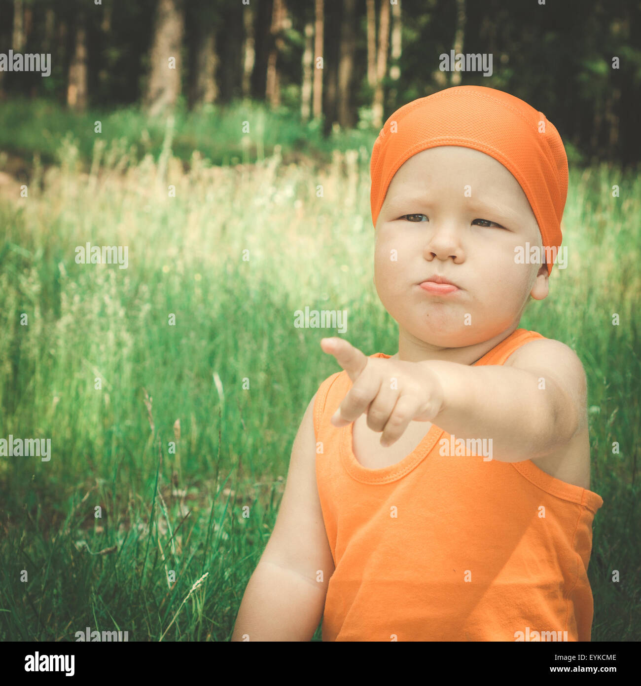 Outdoor portrait of the cute baby pointing Stock Photo - Alamy