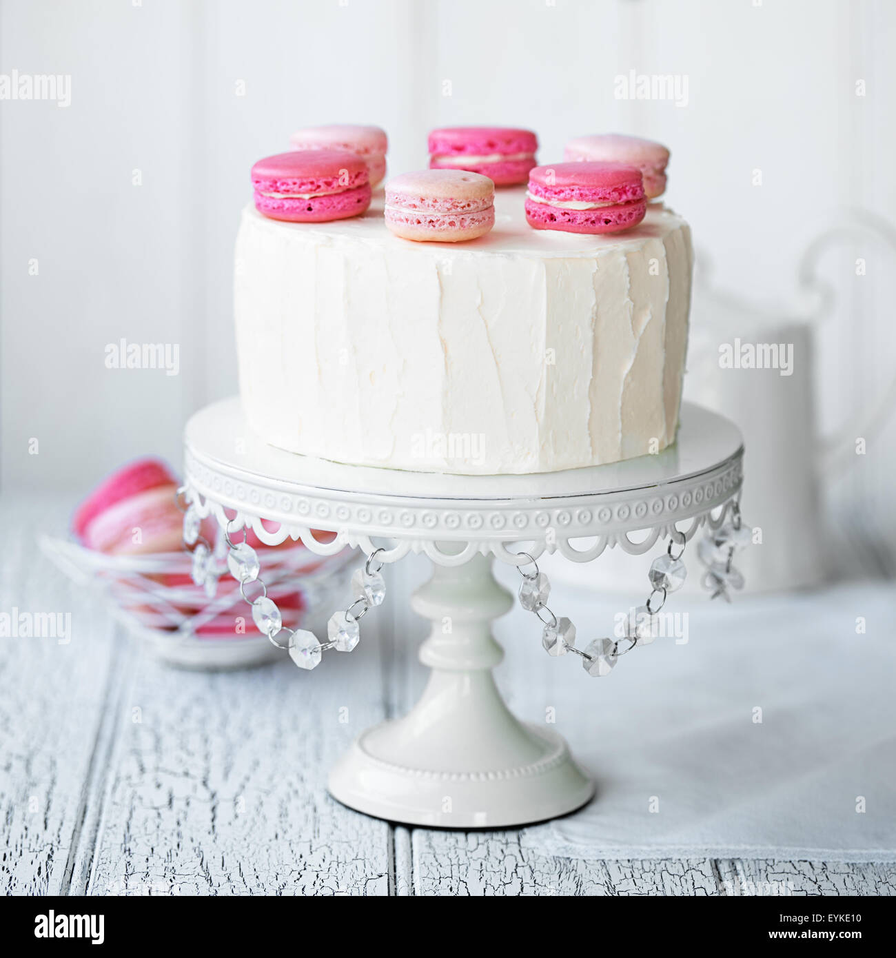 Layer cake decorated with macarons Stock Photo - Alamy