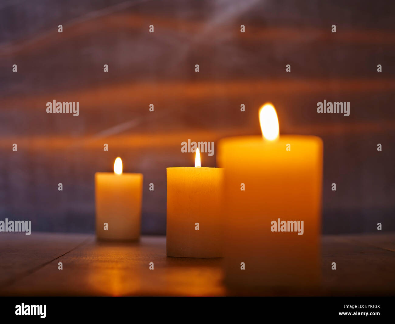 Candles lighted on a table Stock Photo - Alamy