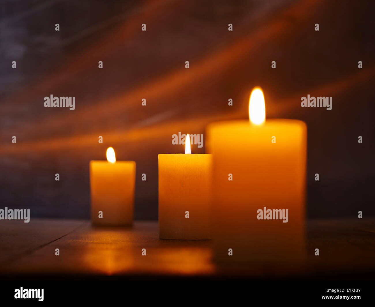 Candles lighted on a table Stock Photo - Alamy