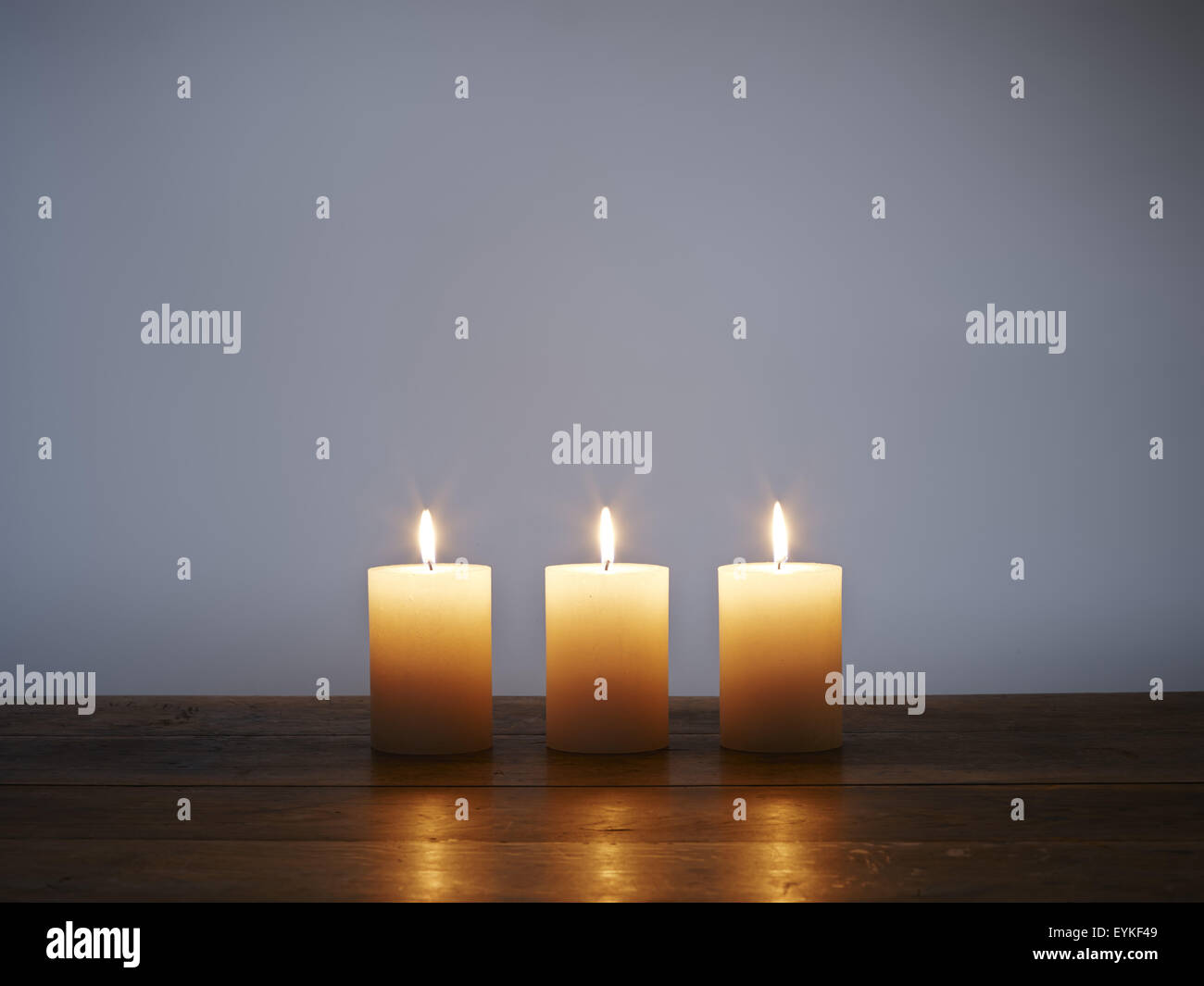 Candles lighted on a table Stock Photo - Alamy