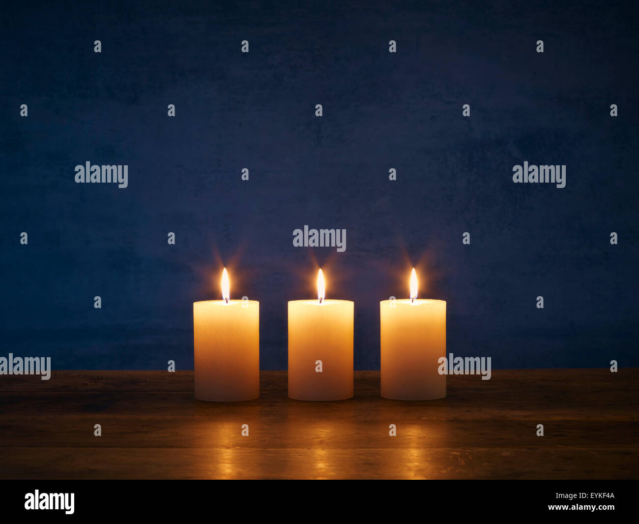 Candles lighted on a table Stock Photo - Alamy