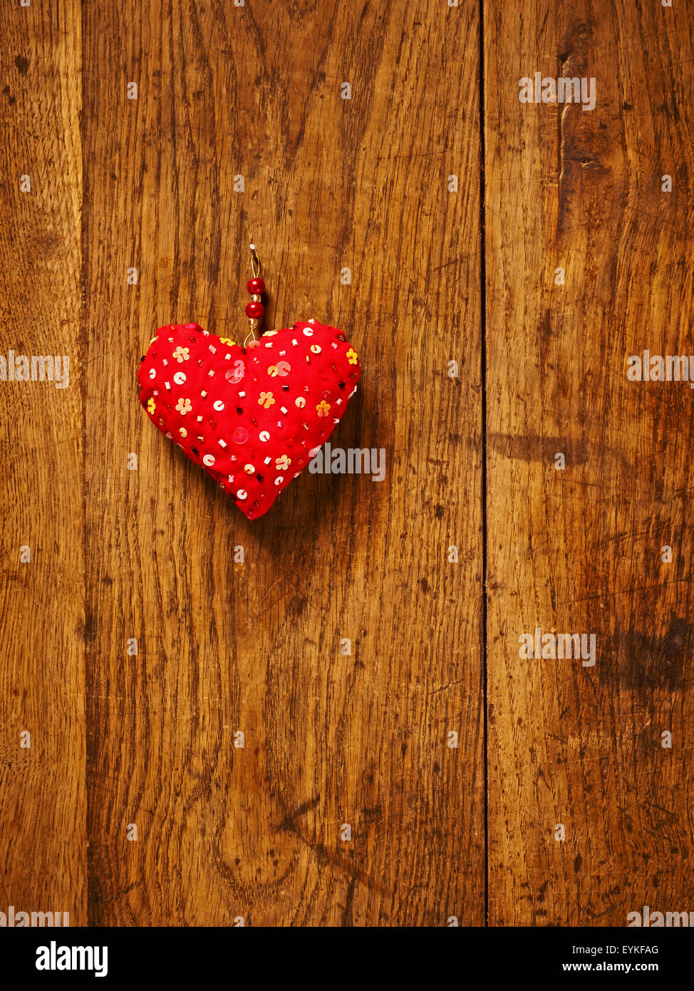 red heart from material on table Stock Photo - Alamy