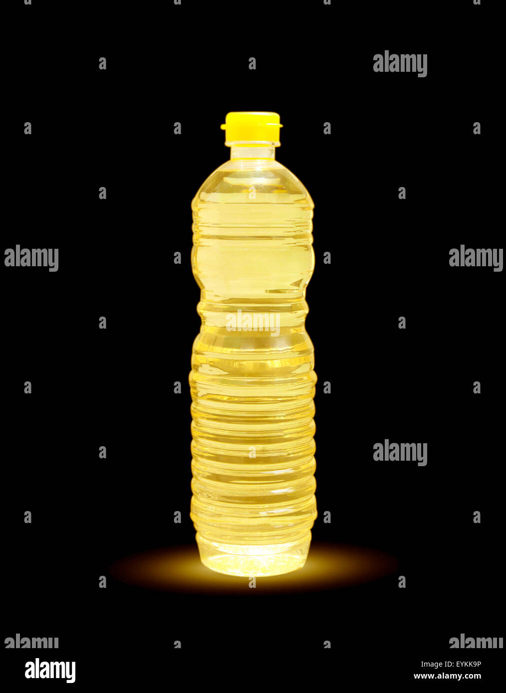 Bottle of vegetable oil for cooking isolated on black background with ...