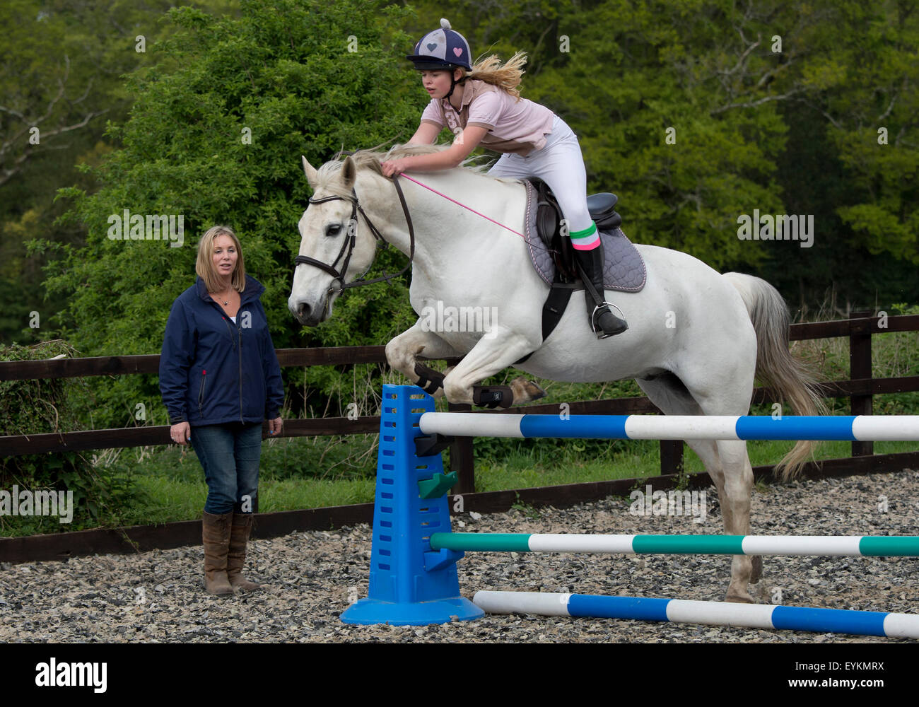 Ella Manning training her horse 'Turner' in a showjumping arena ...