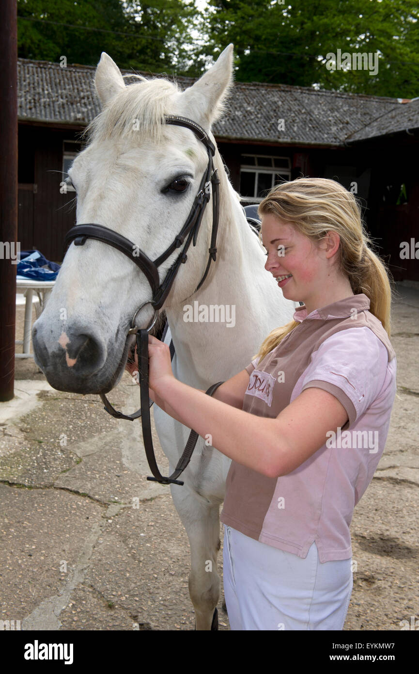 Ella Manning training her horse 'Turner' in a showjumping arena ...